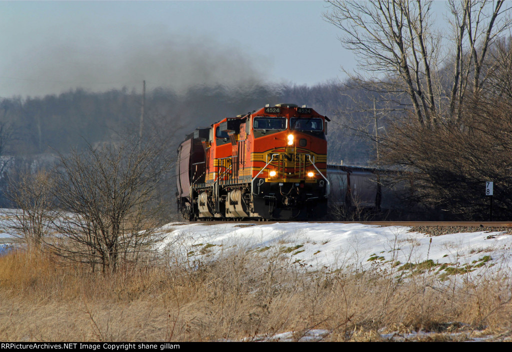 BNSF 4524 Rounds the Mp 78 curve on the k line with a grain train.